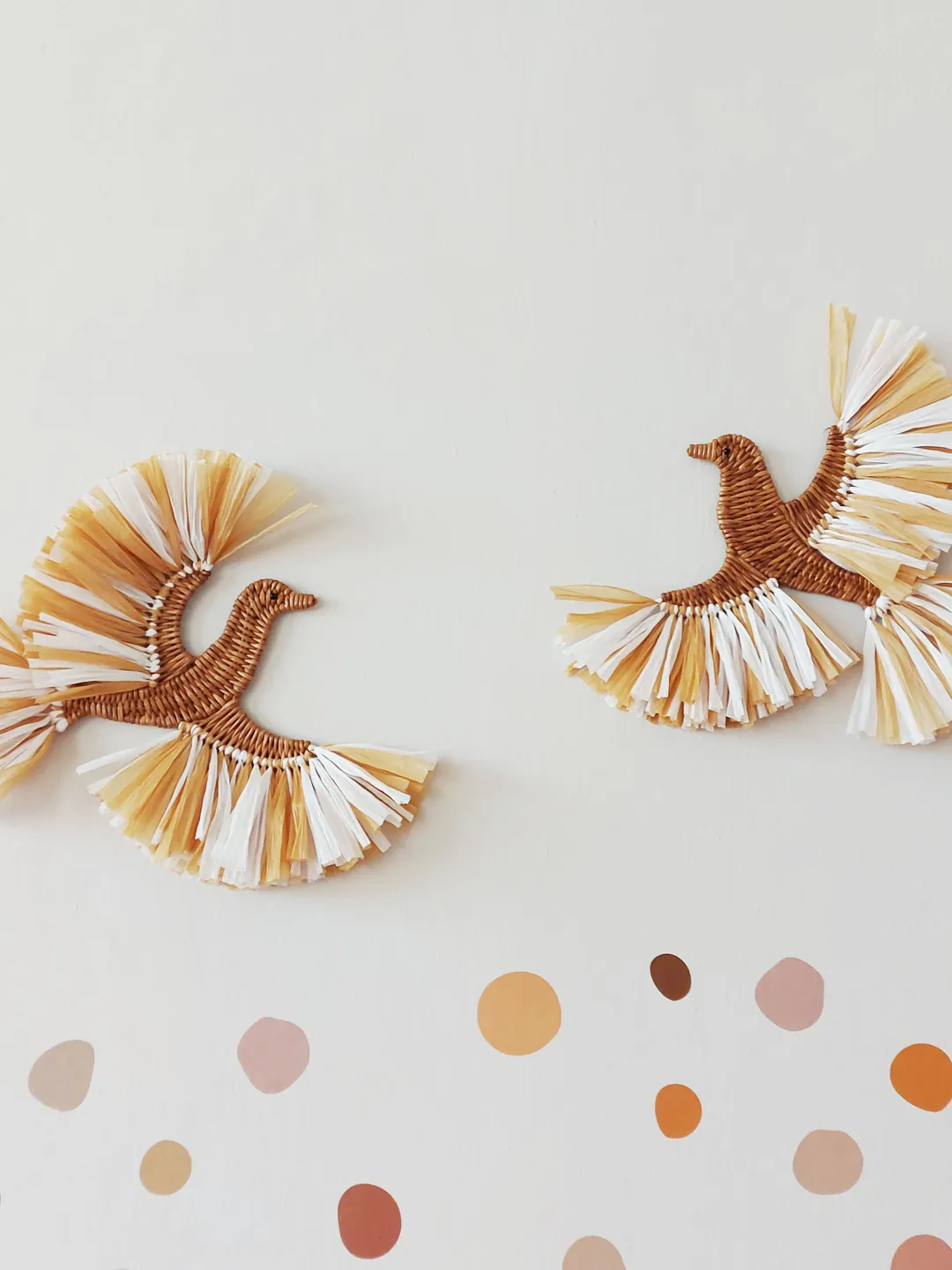 Hanging wicker bird with raffia. Boho wall decor. Handmade phoenix bird