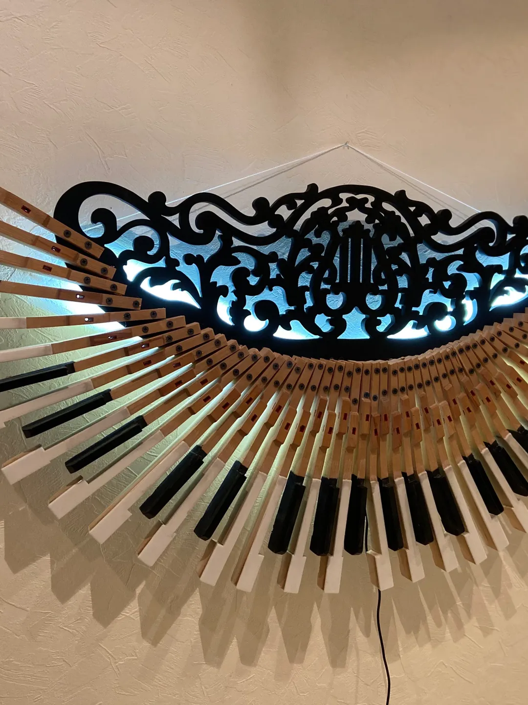 Angel Wings made from old piano keys on a hidden wooden base