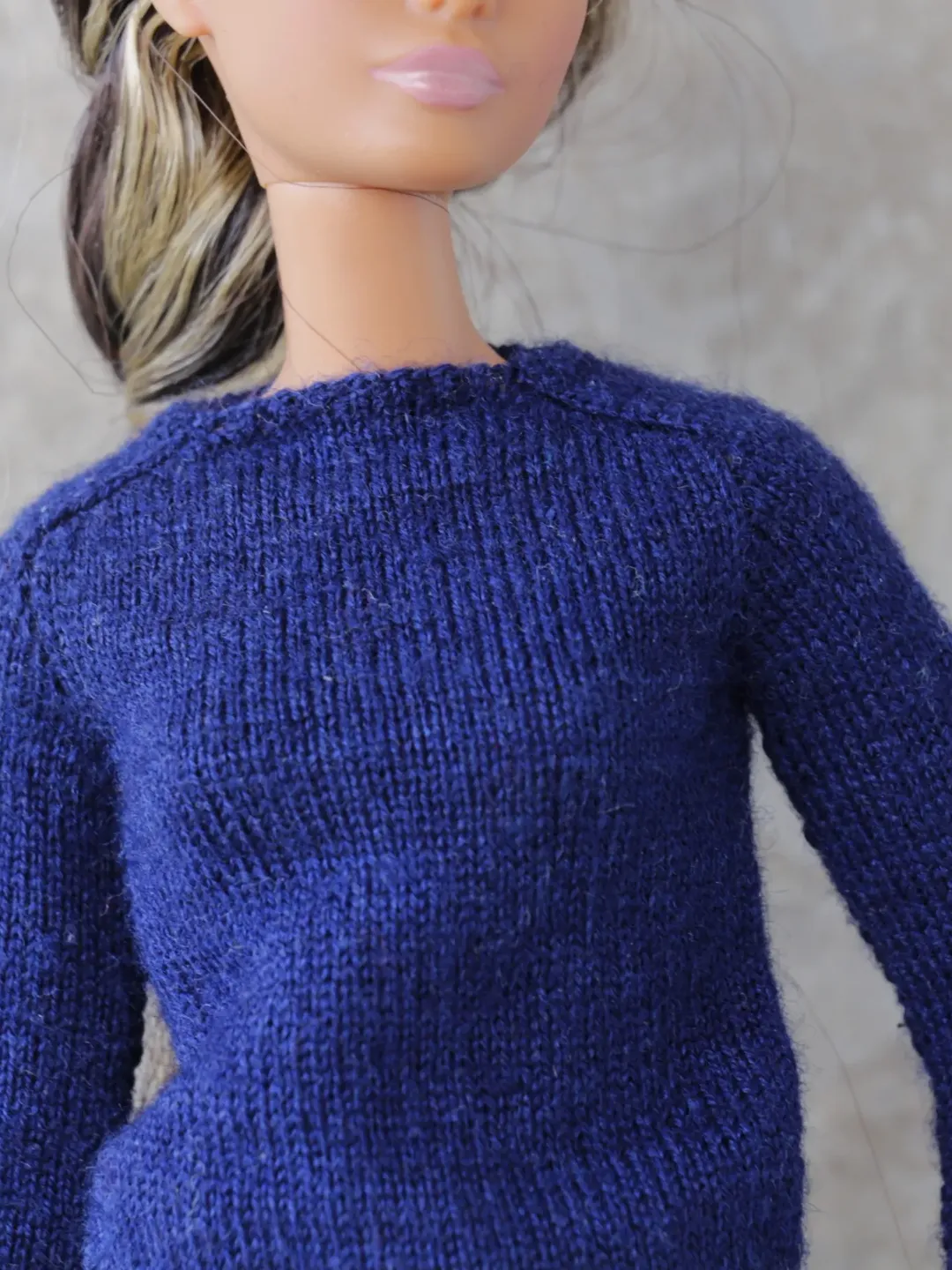 Knitted dark blue sweater for Barbie dolls. Clothes for a Barbie doll.