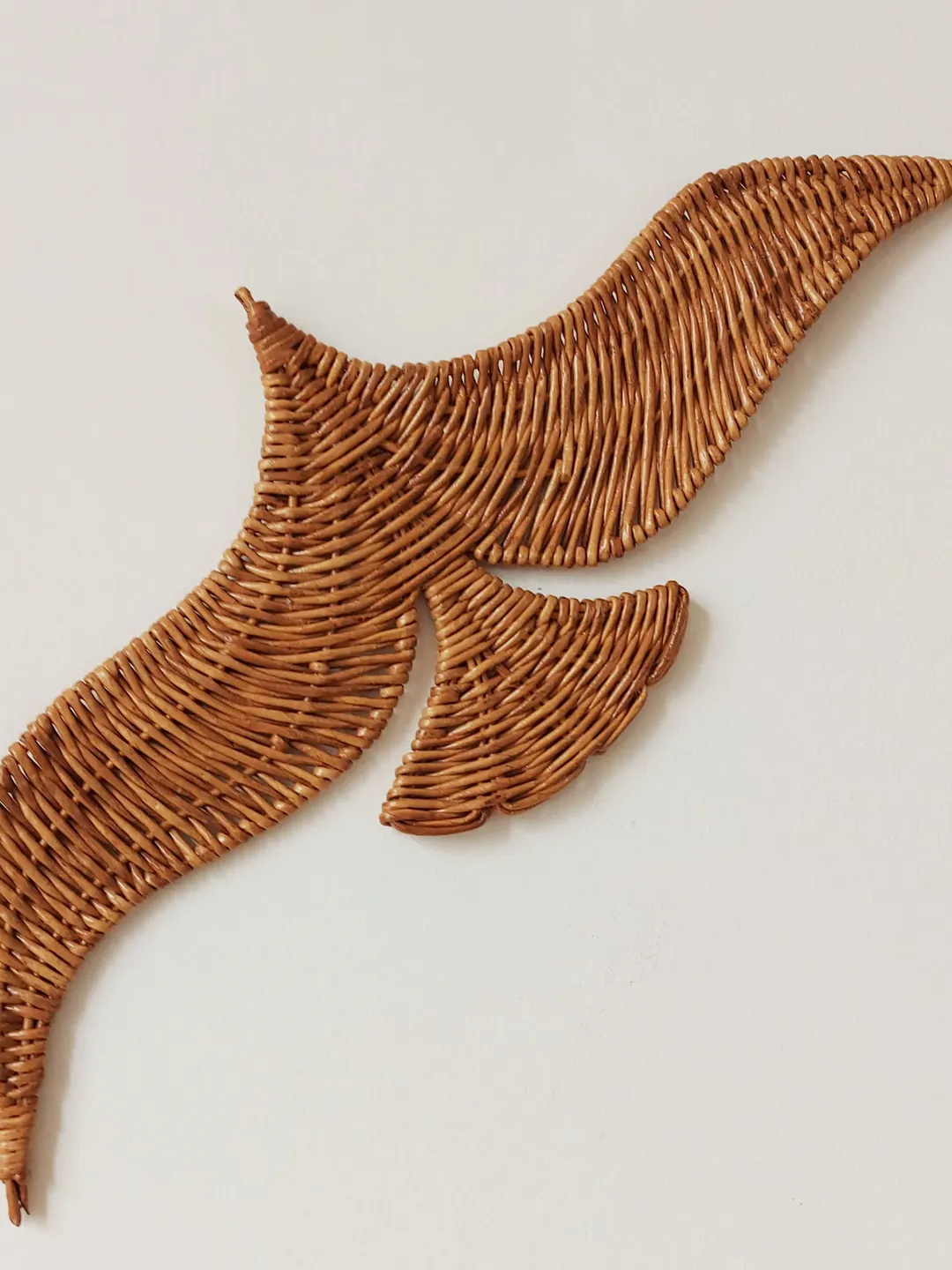 Hanging wicker bird with raffia. Boho wall decor. Handmade phoenix bird