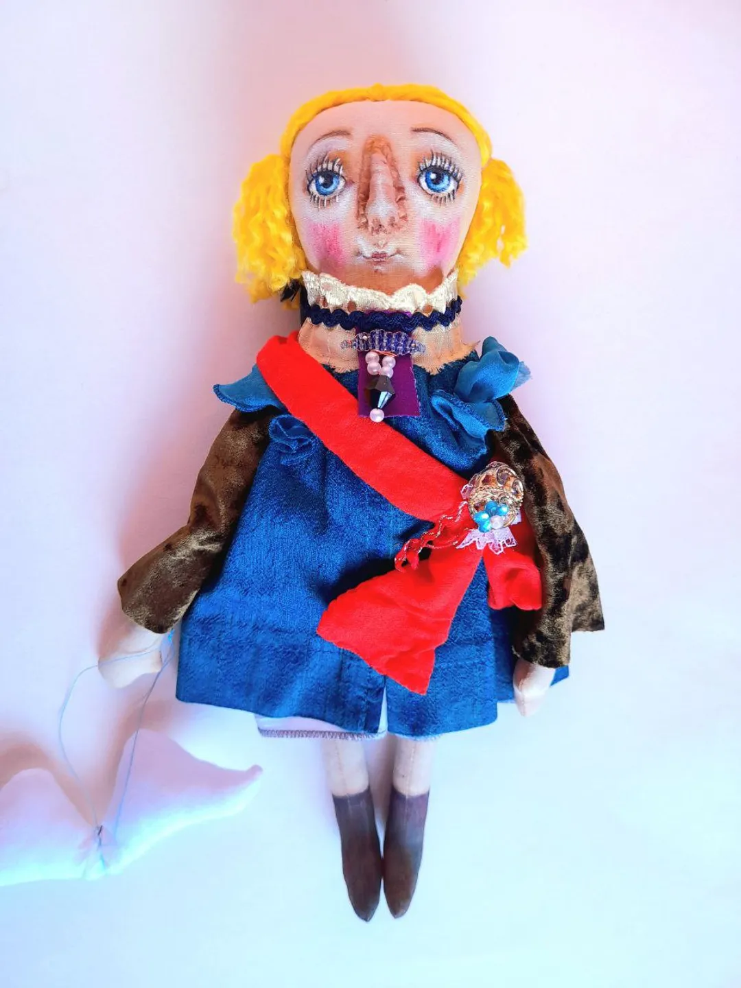 Textile doll yoga girl with dark bun and tattoo
