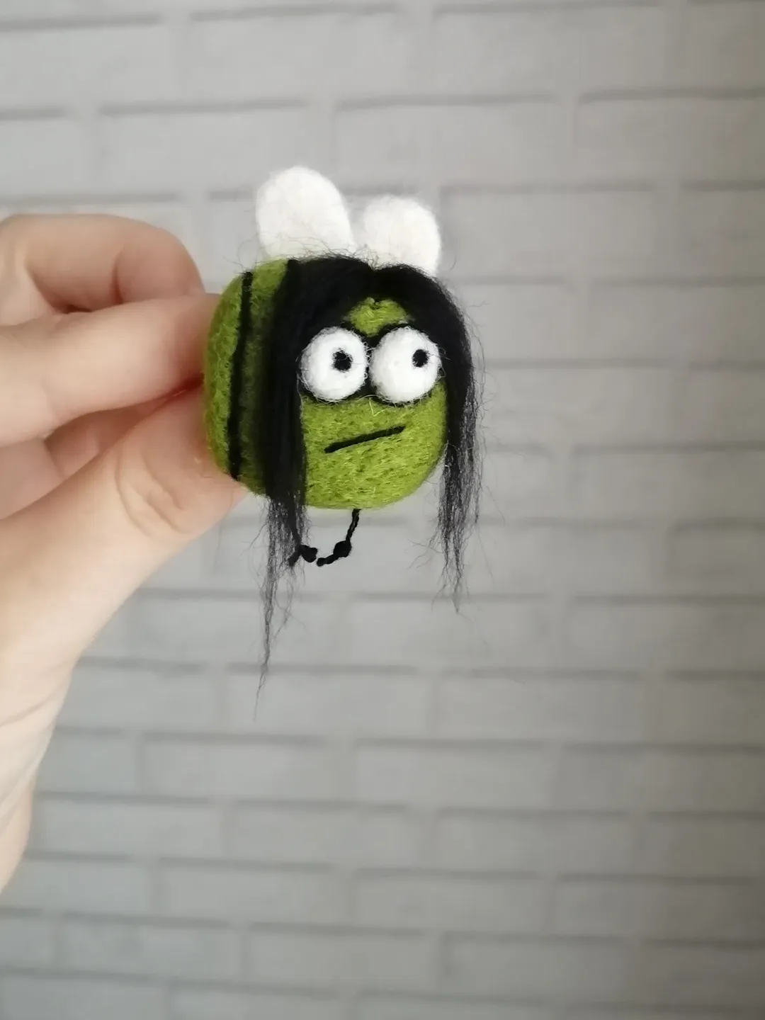 Funny green children's brooch in marsh shades in a gift box