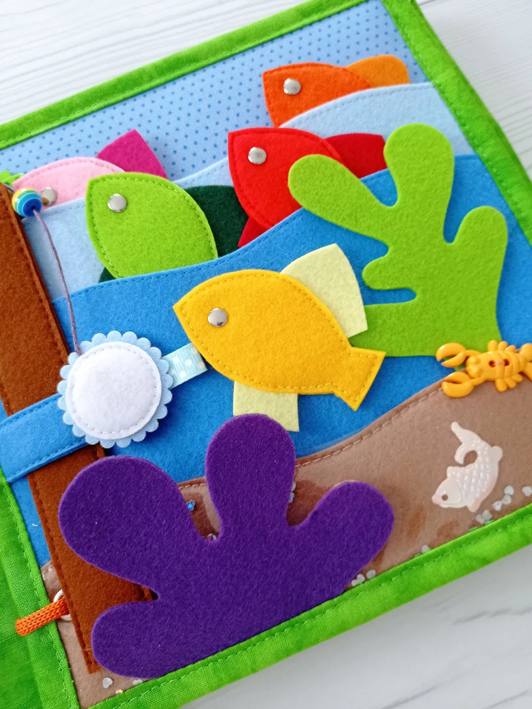 Educational book made of felt and fabric for babies.