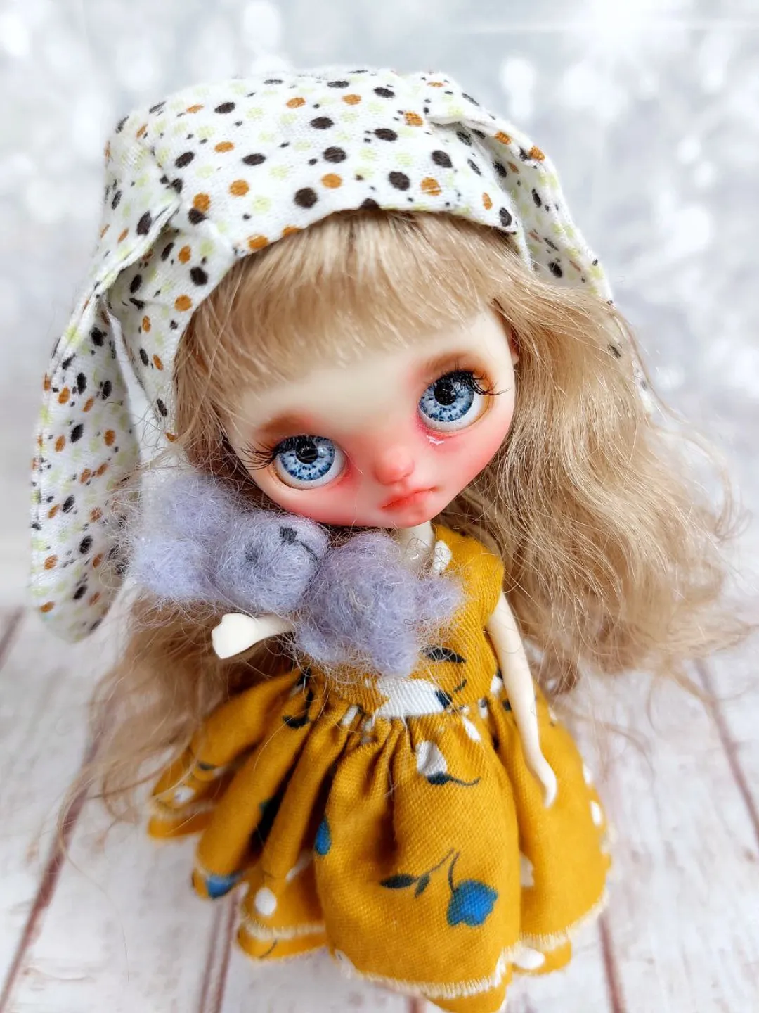 Sad little doll. Crying baby.