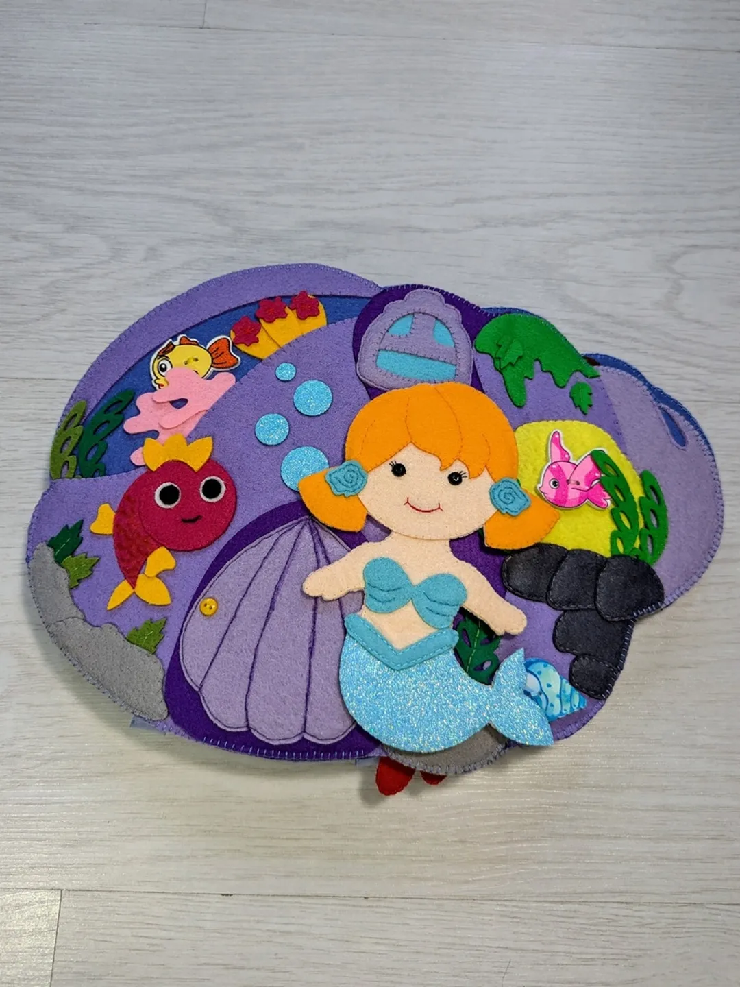 Educational book made of felt and fabric for babies.