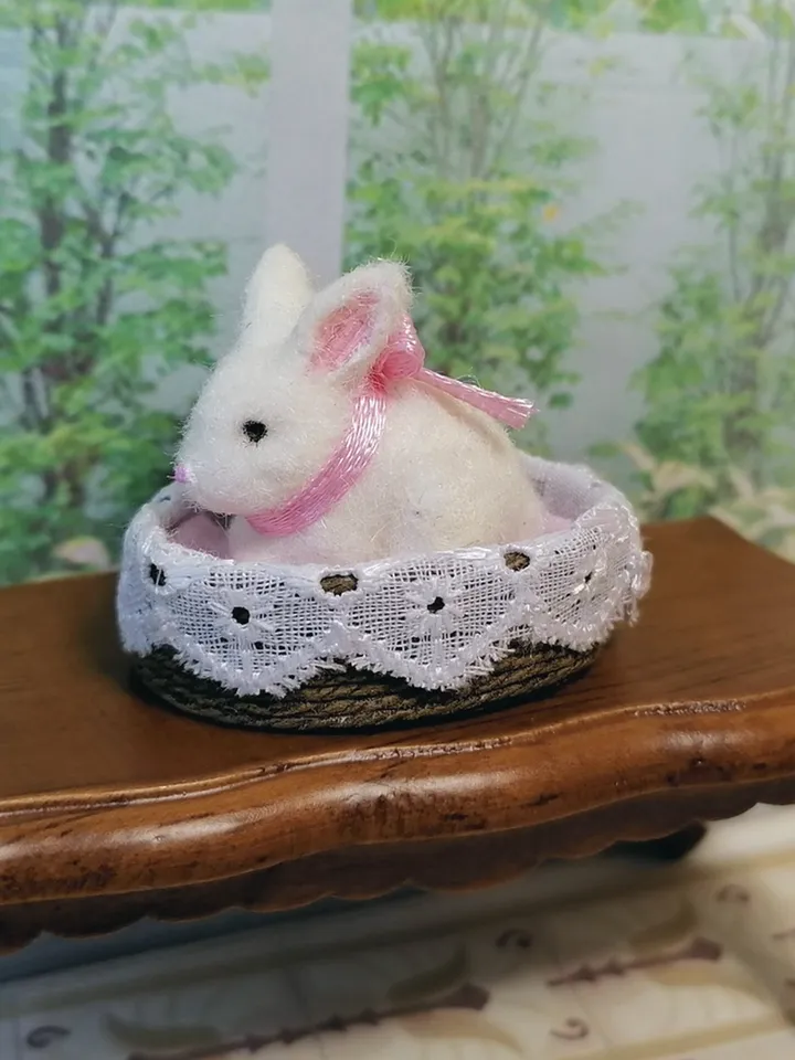 Rabbit in the basket. Puppet miniature.